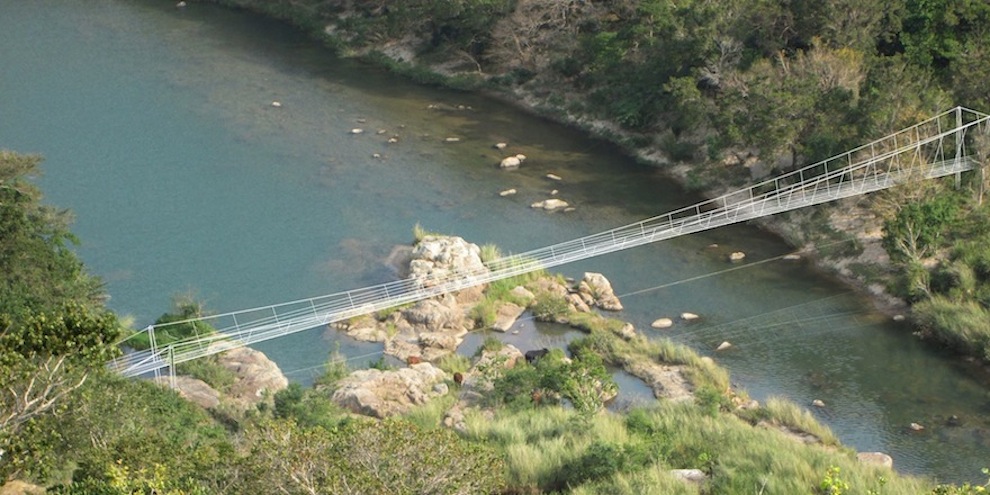 A new bridge across the Mzamba River connects a rural community to ...