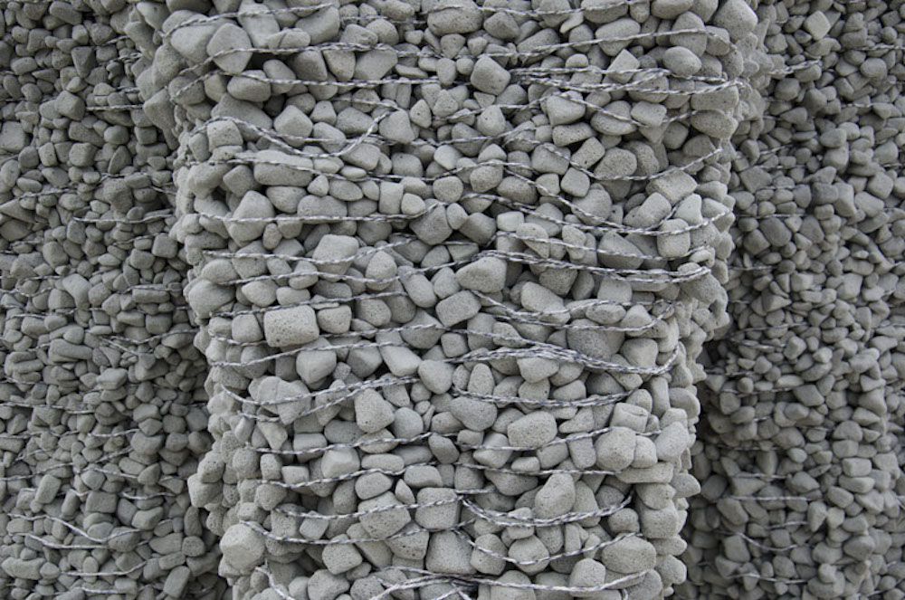 Robots build a stone tower with one piece of thread | Design Indaba