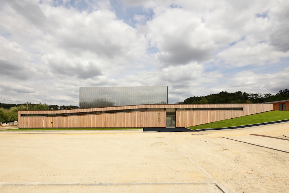 This thoroughly modern French school is located in protected woodland ...