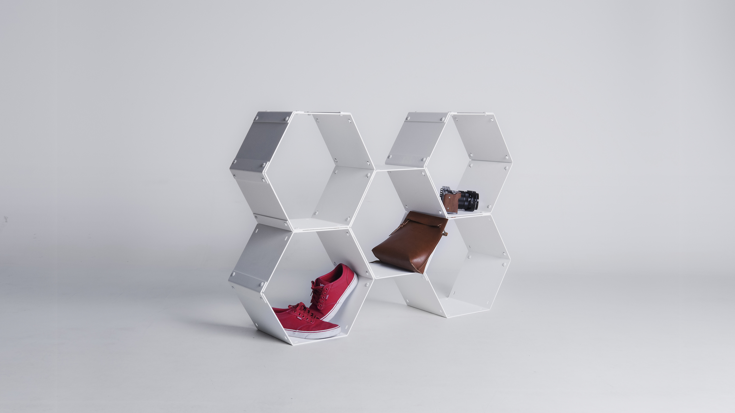 Graphite: a modular honeycomb-shaped shelving system | Design Indaba